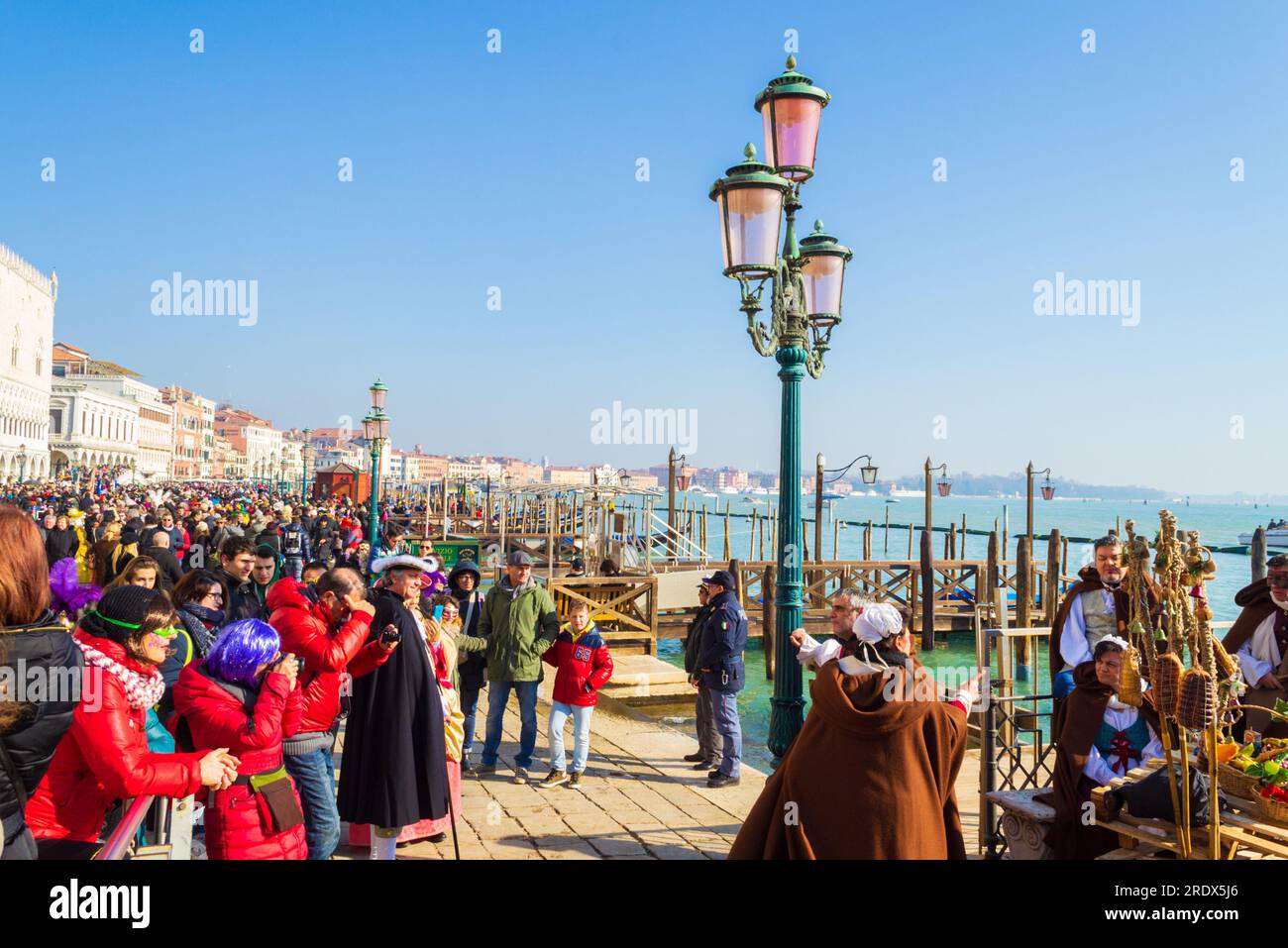 Venice Carnival Celebration at busy waterfront street in front of Doge ...