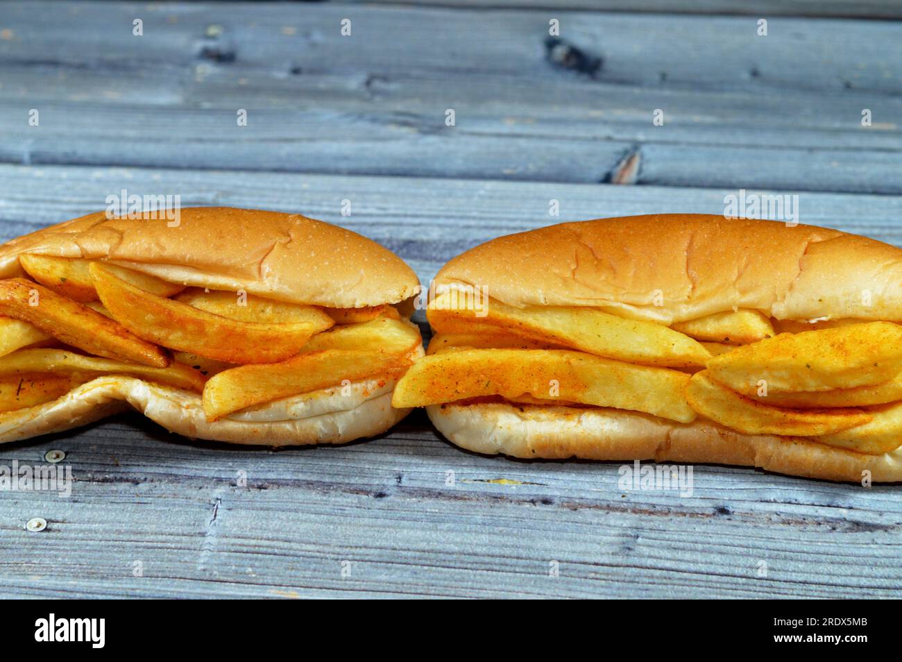 French fries fingers Texas spices sandwich in a long bun, French fries ...