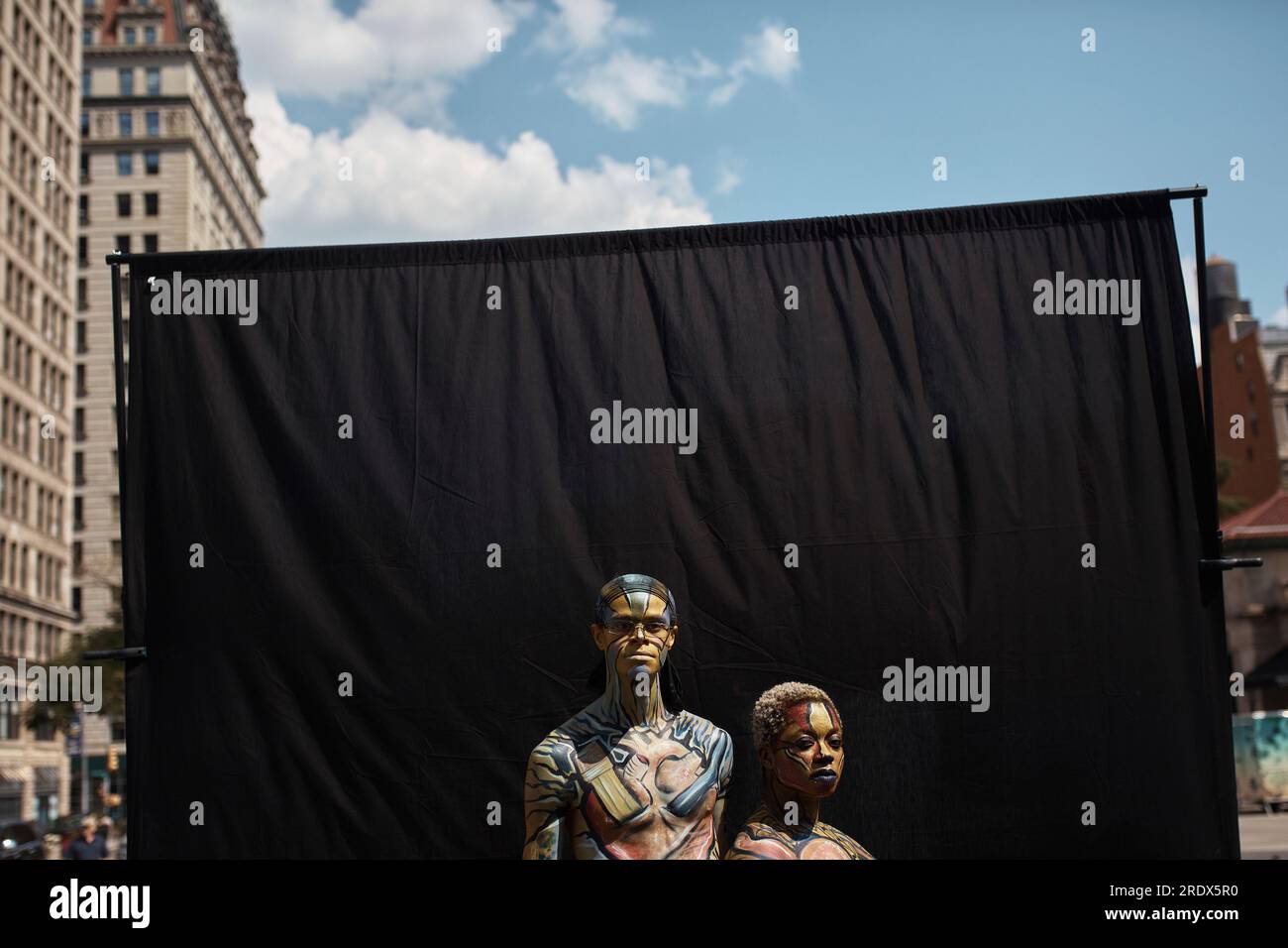 Models painted by an artist pose during Human Connection Arts Annual ...