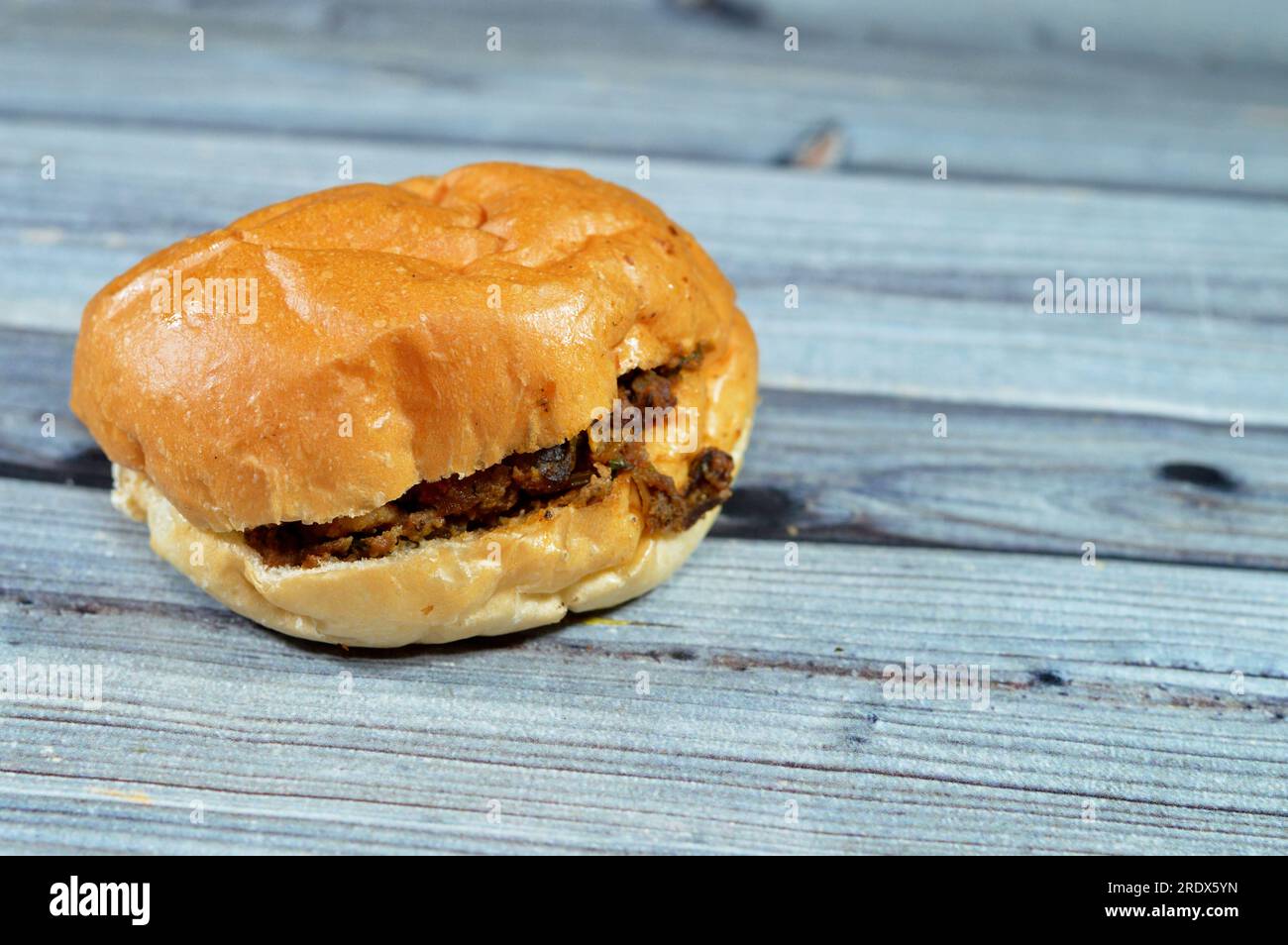 Beef meat shawarma sandwich in a bun, a popular Middle Eastern dish ...