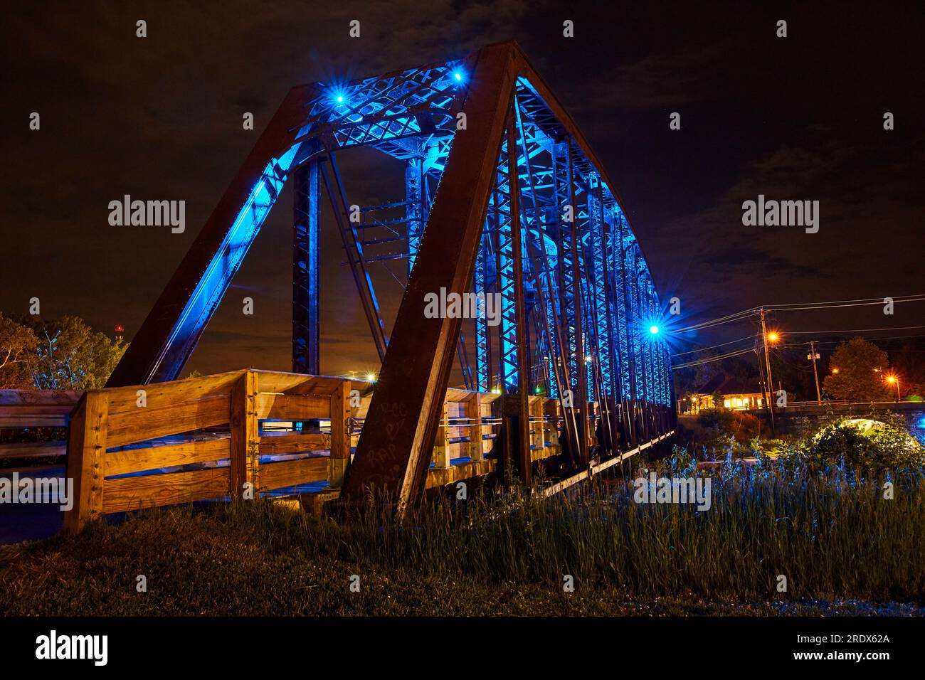 Night shot of blue neon lights on Mount Vernon truss train bridge ...