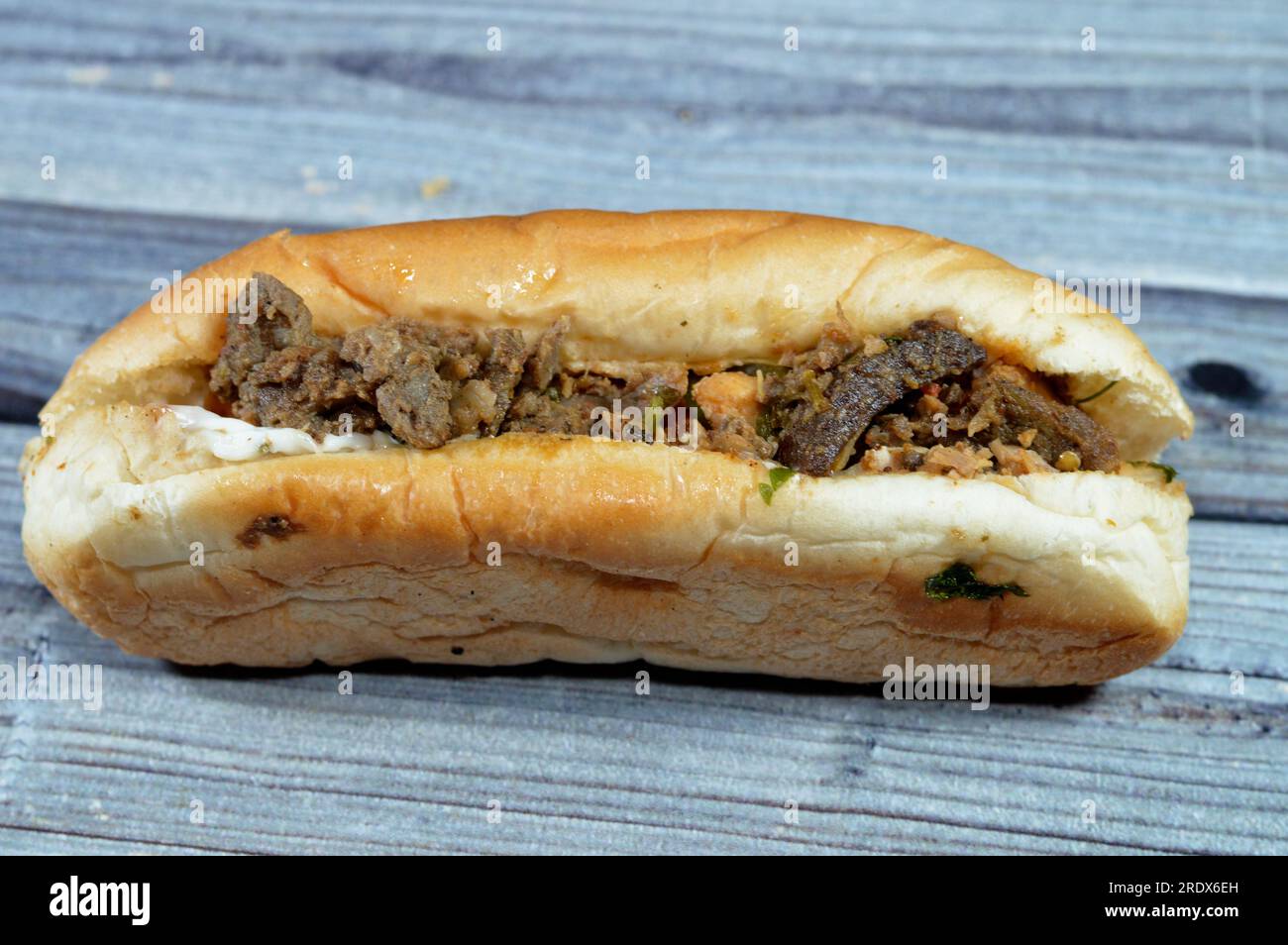 Beef meat shawarma sandwich in a bun, a popular Middle Eastern dish ...