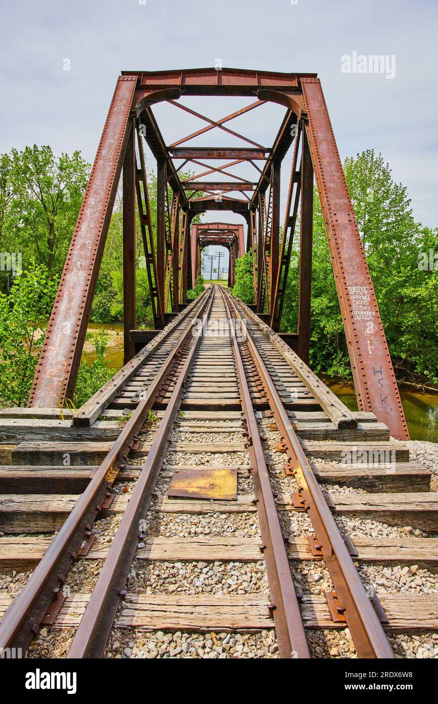 Vertical shot of iron train bridge with railroad tracks over Kokosing ...