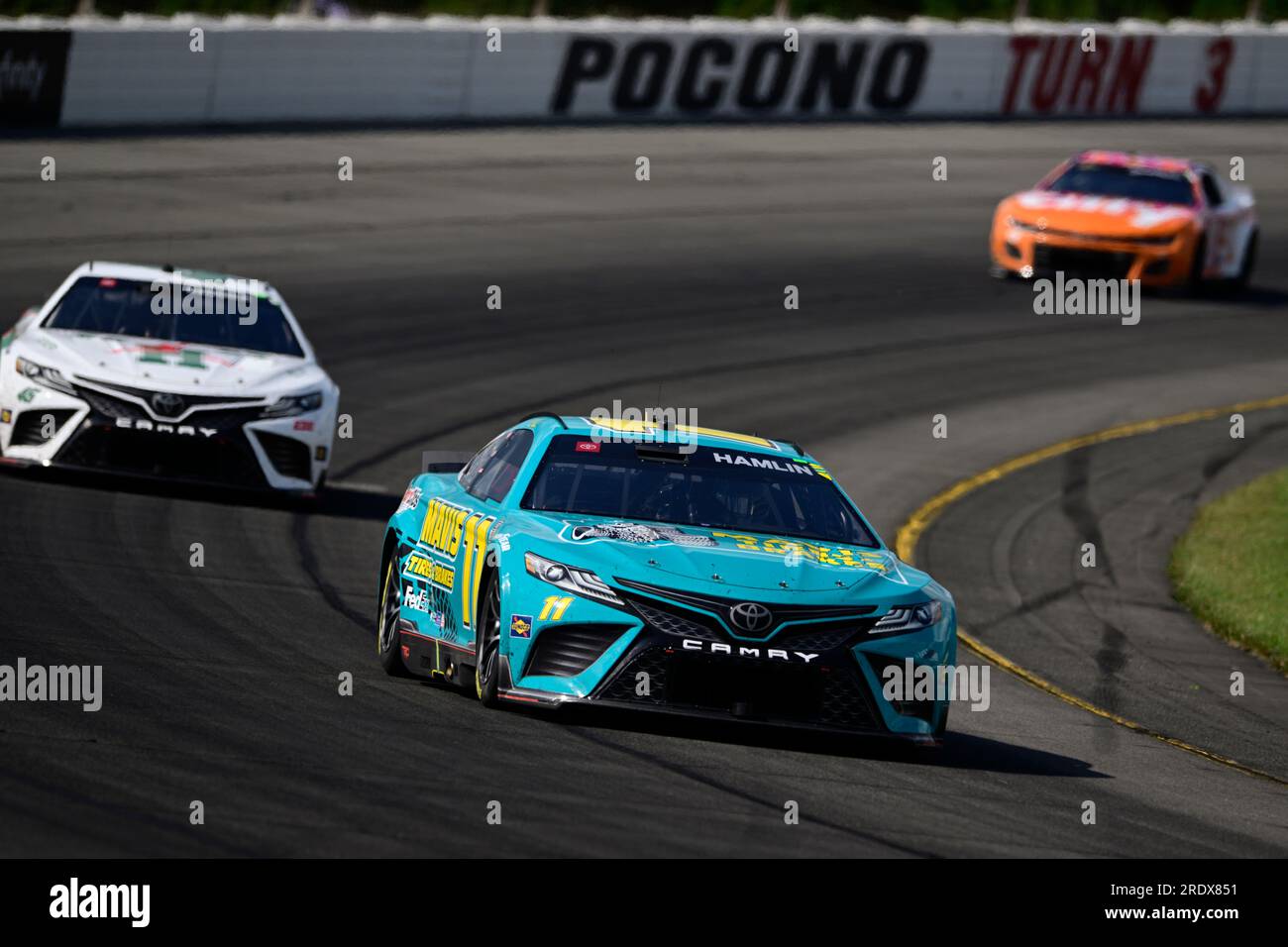 Denny Hamlin (11) drives through Turn 3 during a NASCAR Cup Series auto ...