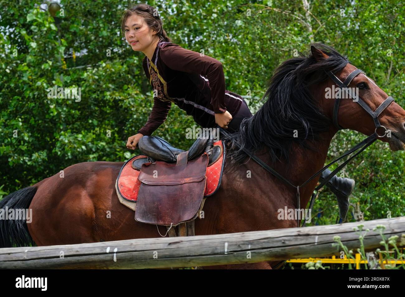 Kazakhstan, Huns Ethno Village. Woman Demonstrating Traditional Kazakh Nomadic Riding Skill ...