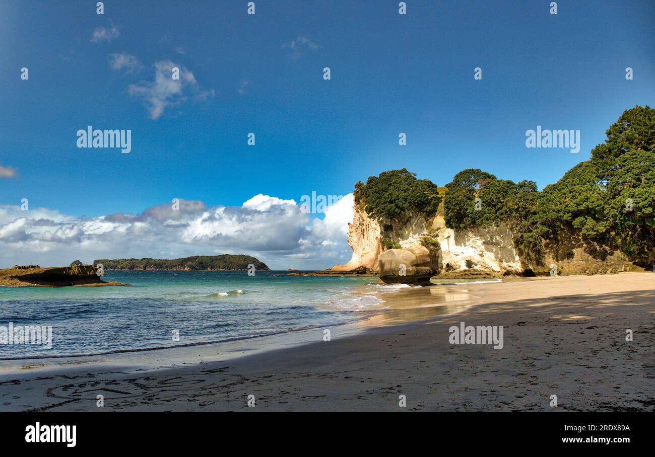 The golden beach and stunning rock formations and archway at Cathedral ...
