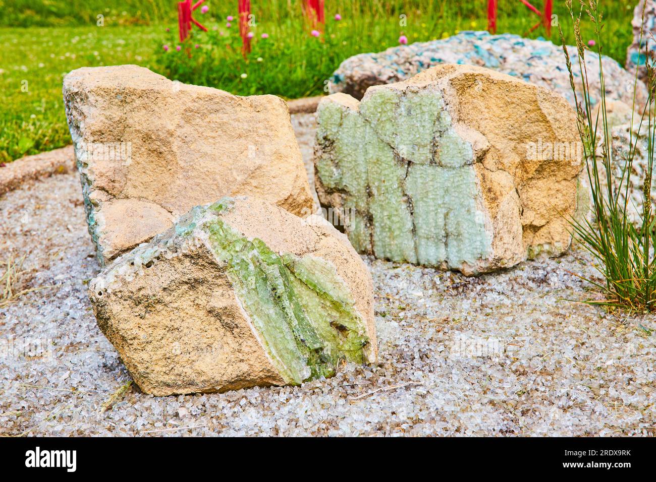 Glass coating rock and concrete like a geode with clear shards on ...