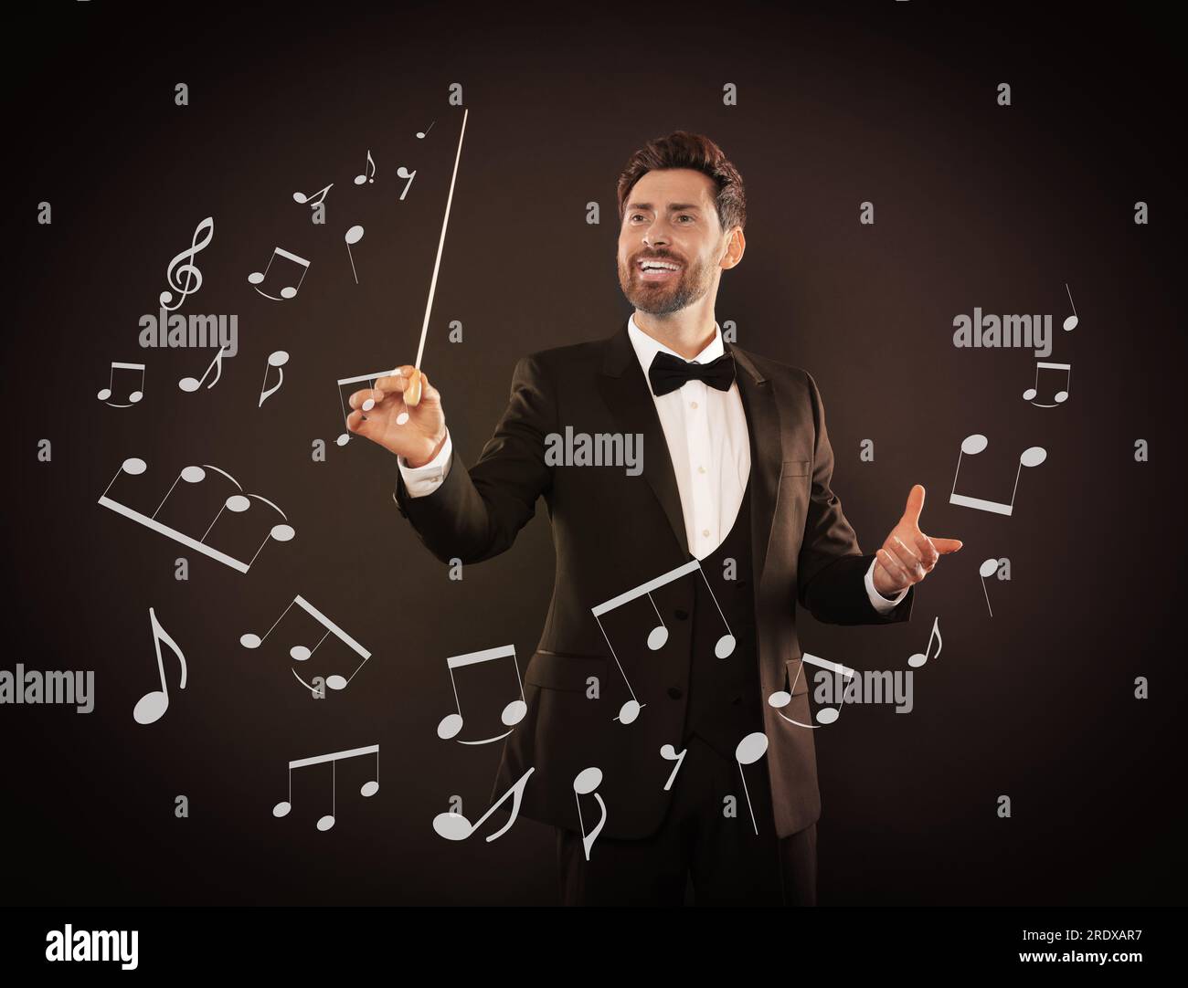 Conductor on dark background. Music notes flying from baton Stock Photo ...