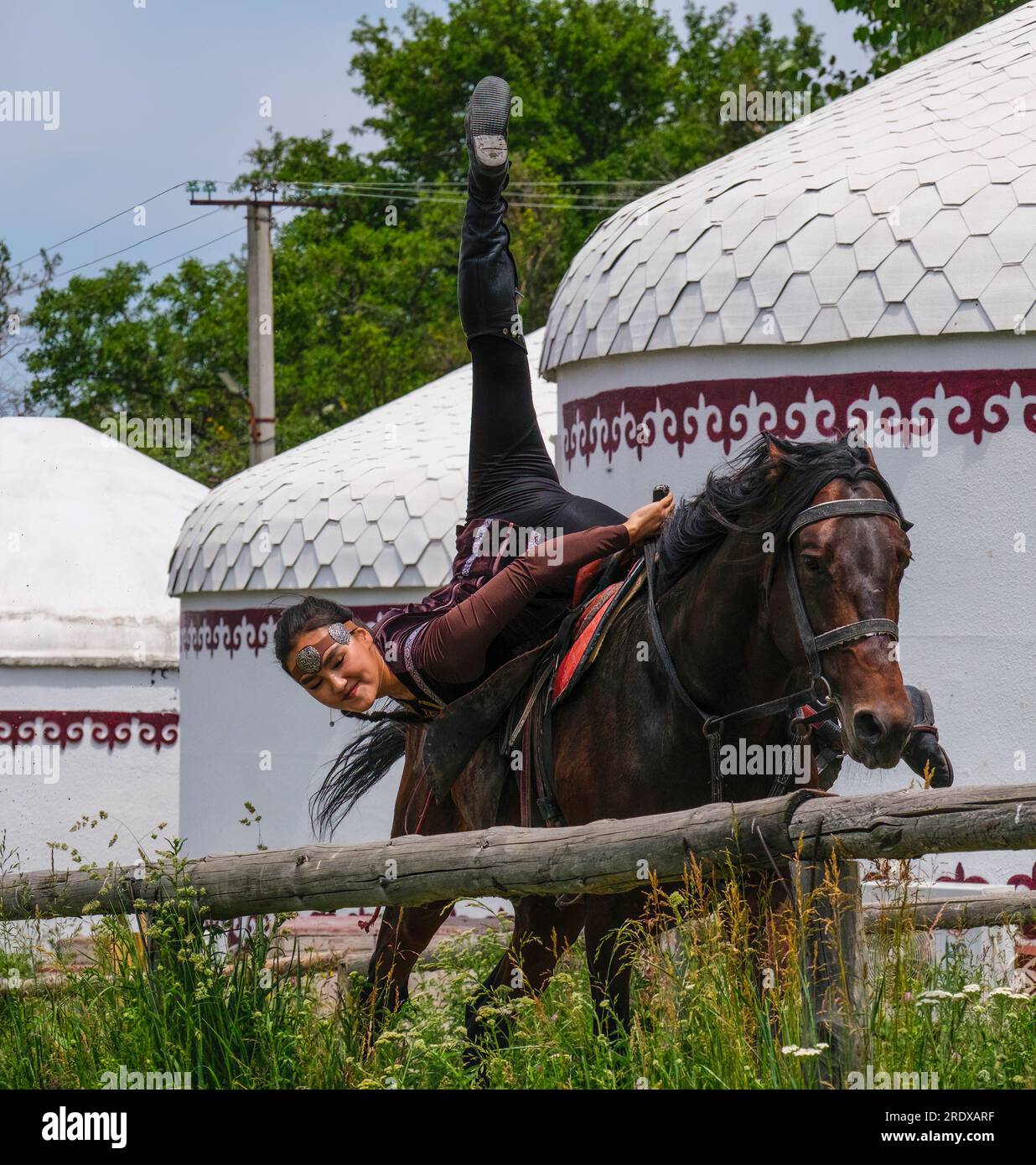 Kazakhstan, Huns Ethno Village. Woman Demonstrating Traditional Kazakh Nomadic Riding Skill ...