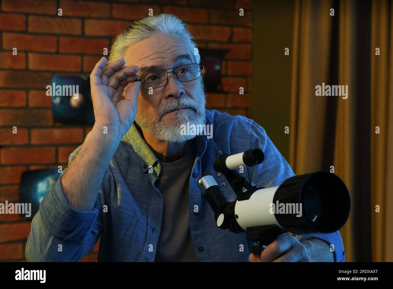 Person using telescope at night hi-res stock photography and images - Alamy