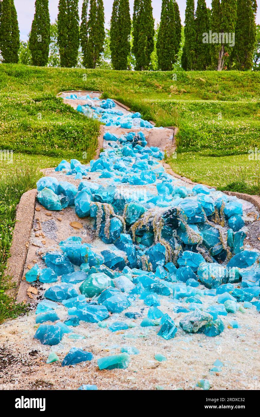 Magical turquoise glass road leading to line of hedge trees Stock Photo ...