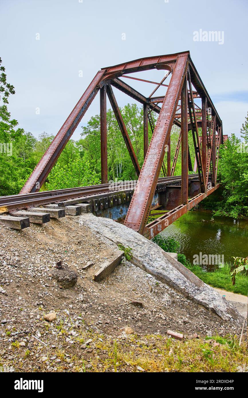 Rusty iron train track bridge at Heart of Ohio Trail with Kokosing ...