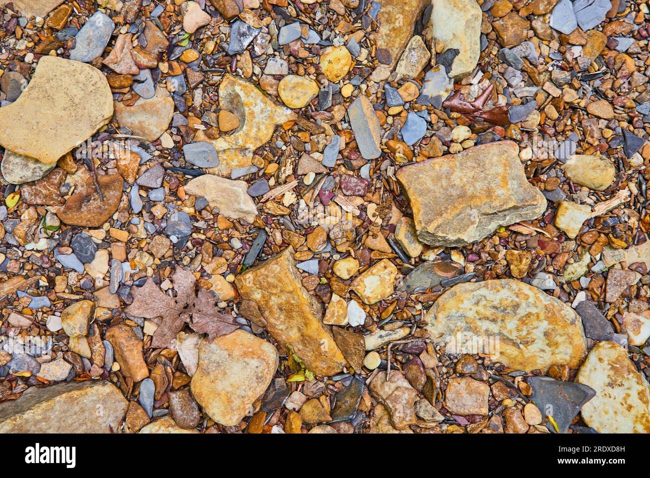Tiny pebbles to larger rocks in colorful random river rocks and shale ...