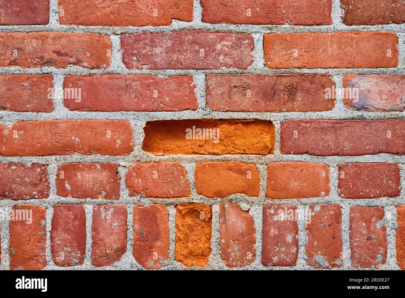 Background asset crumbled red bricks on wall with long and short bricks ...