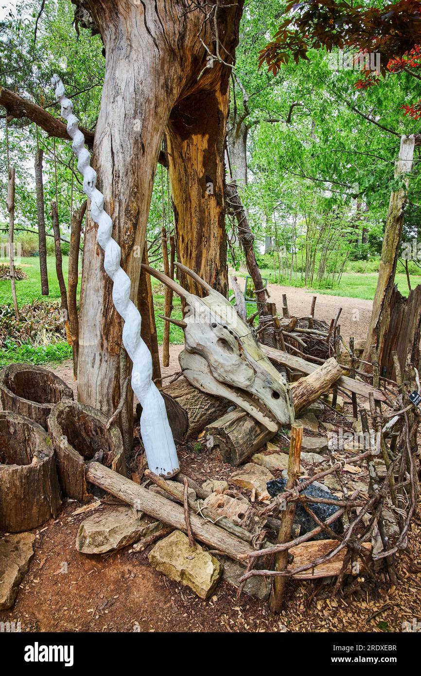 Dragon skull near tree with open archway in middle and surrounded by ...