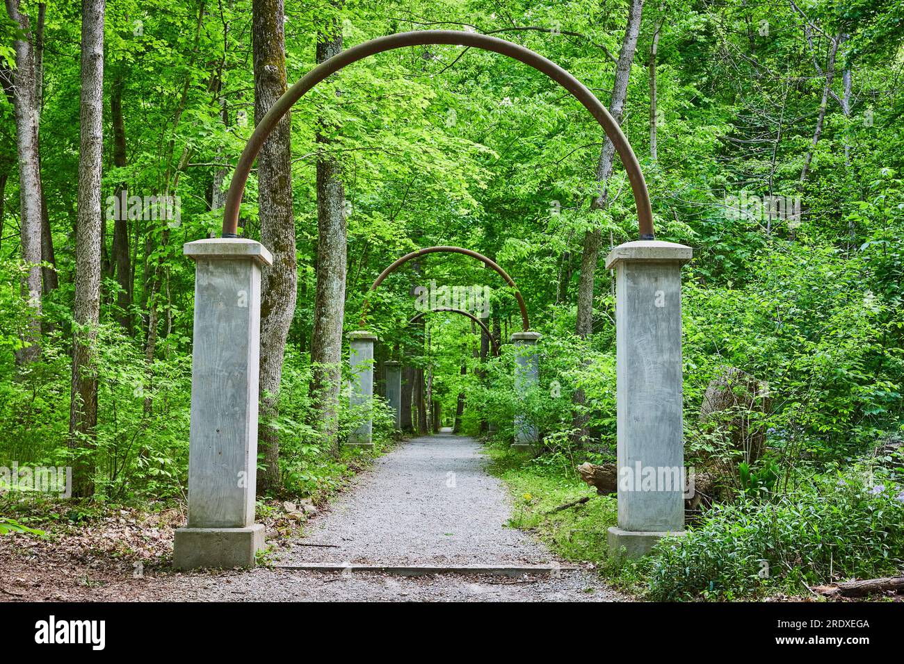 Row of white stone pillars, metal arches, Rose Island, Walkway of Roses ...