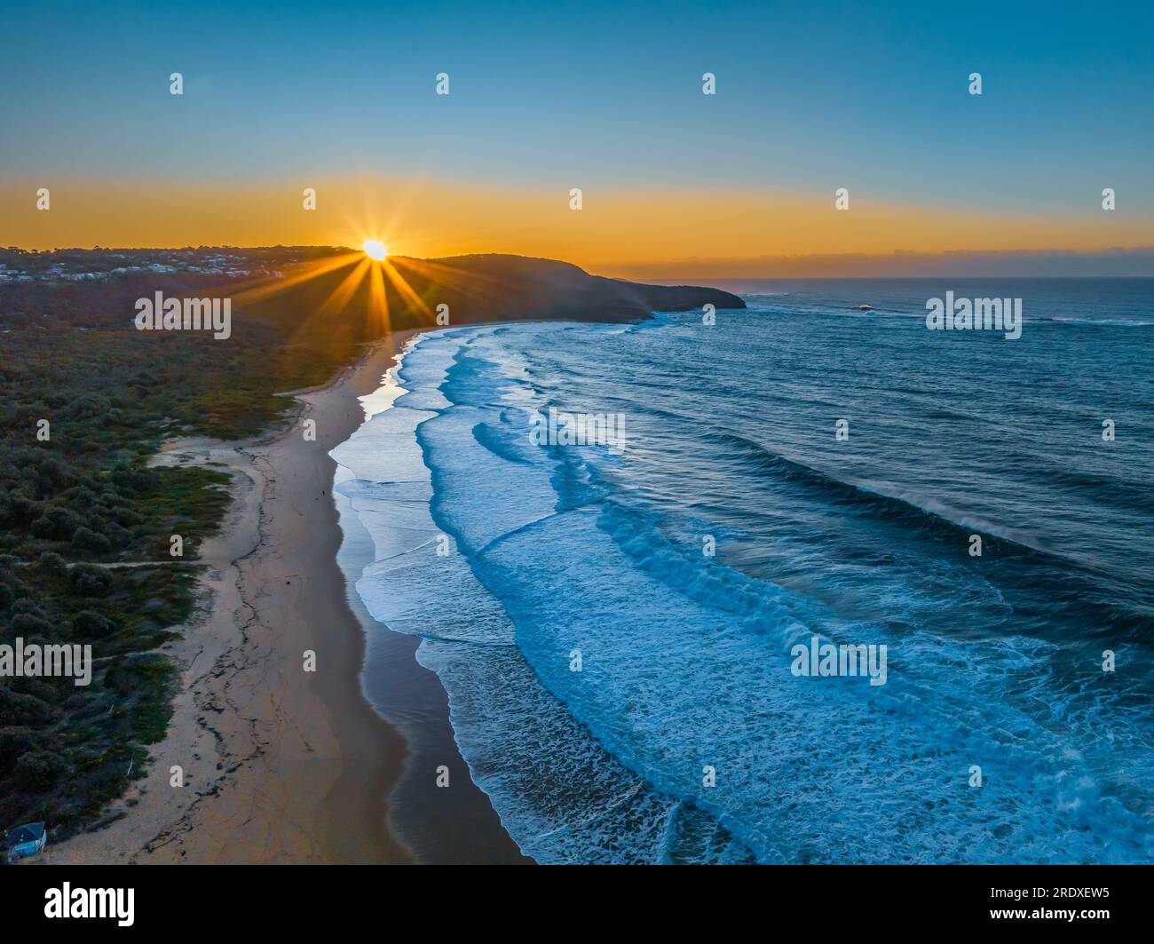 Aerial sunrise seascape with good size waves at Killcare Beach on the ...