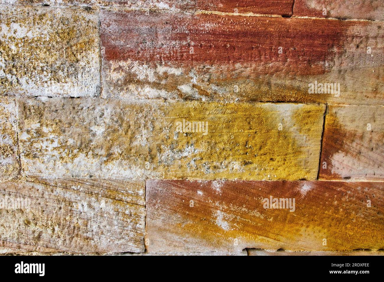 Large horizontal brick with surrounding stone bricks of bright earth ...