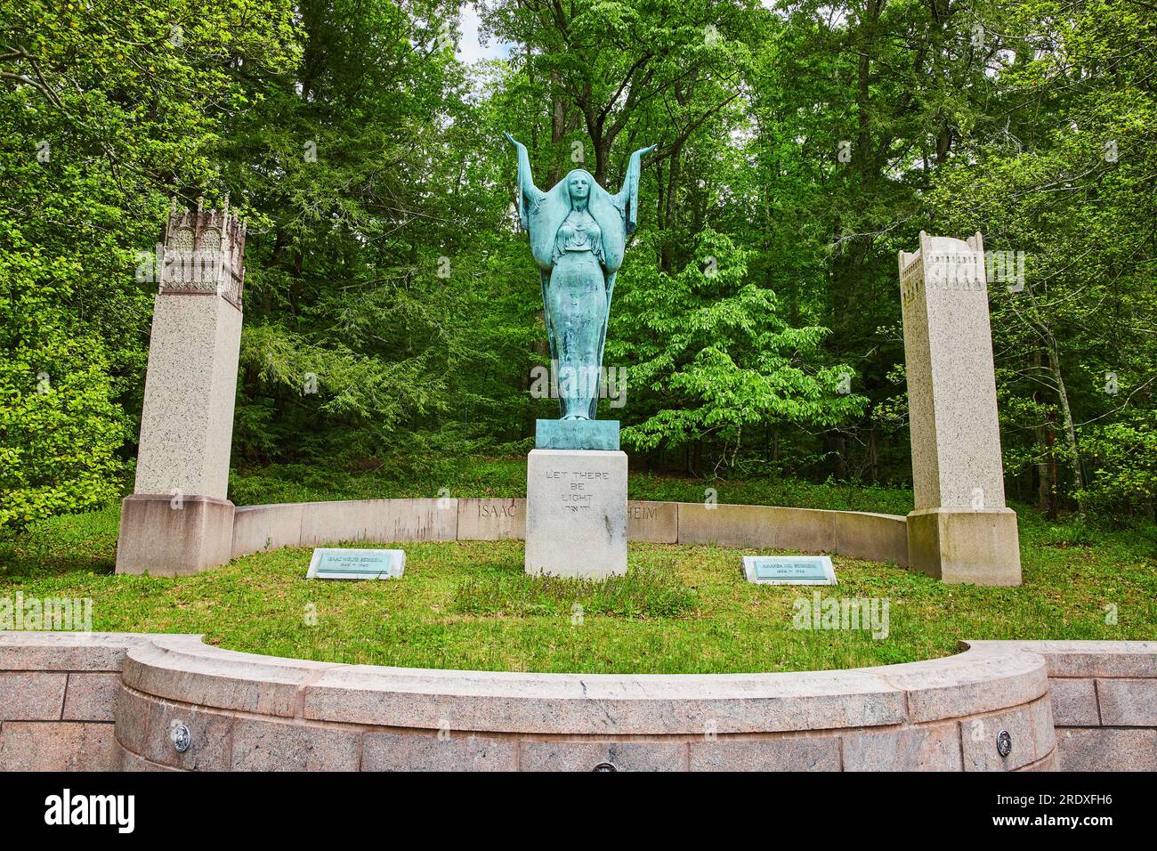 Let There Be Light statue at gravesite and gravestones of husband and ...