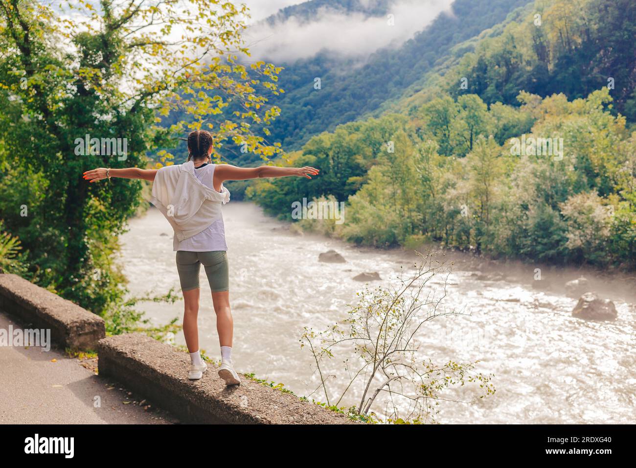Happy romantic woman look at the river in mountain in Abkhazia Stock ...