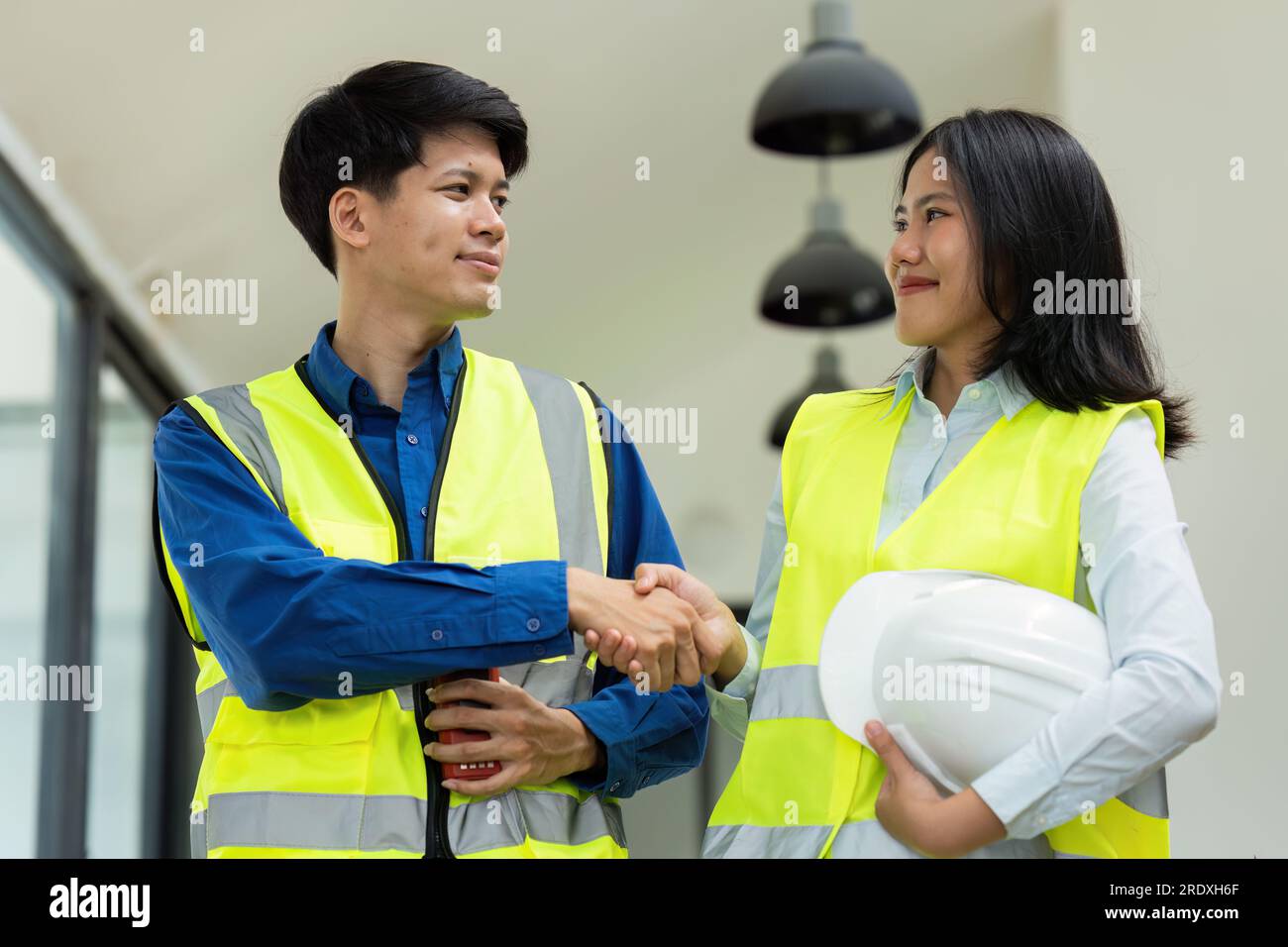 Civil engineers and architects handshake after work done at the office ...