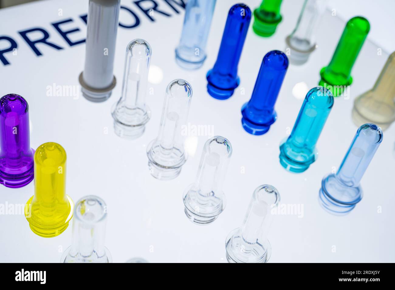 PET plastic bottle preforms before blow molding. Packaging industry ...