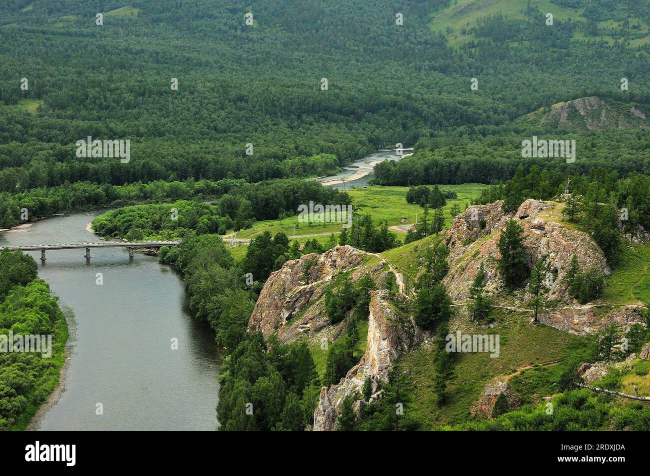 View from the top of the mountain to the riverbed flowing through the ...