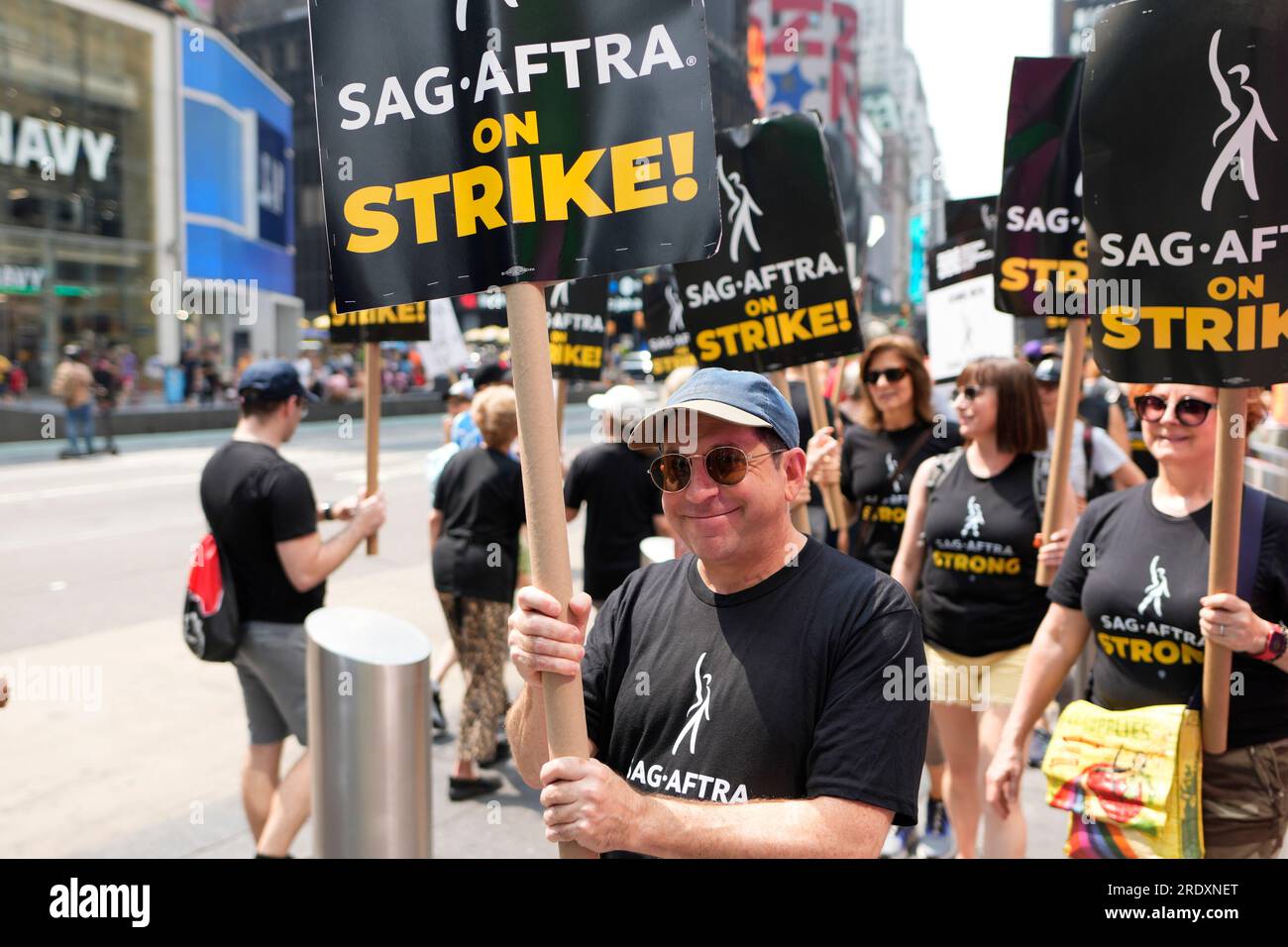 FILE - Actor Jason Kravits carries a sign on a picket line outside ...