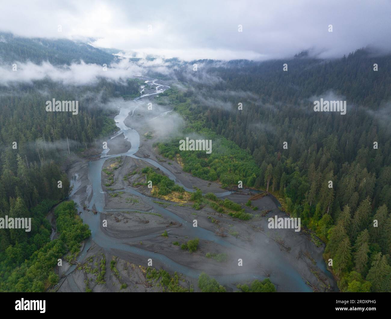 Clouds drift over the Hoh river as it flows through one of the largest ...