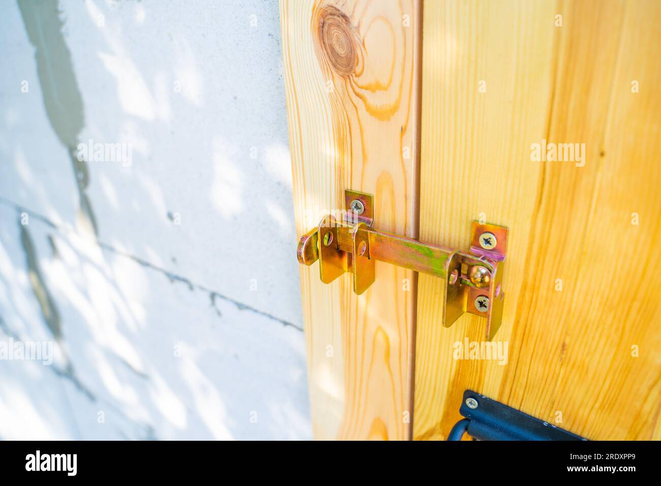 Garden decorative door latch of golden color on wooden doors of their ...