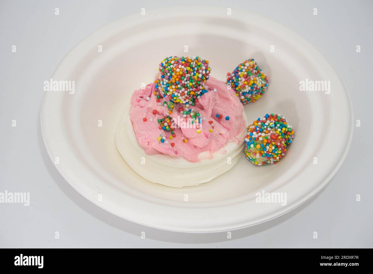 Pink Fairy bread meringue with 100's and 1000's on a white background ...