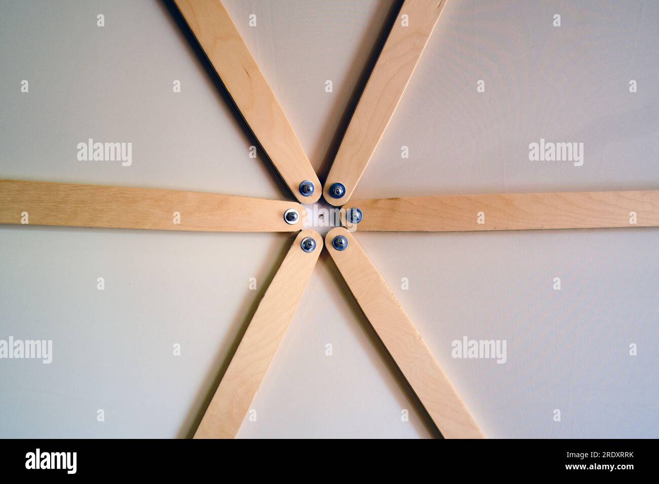 Six-pointed mounting of slats roof structure inside a round house ...