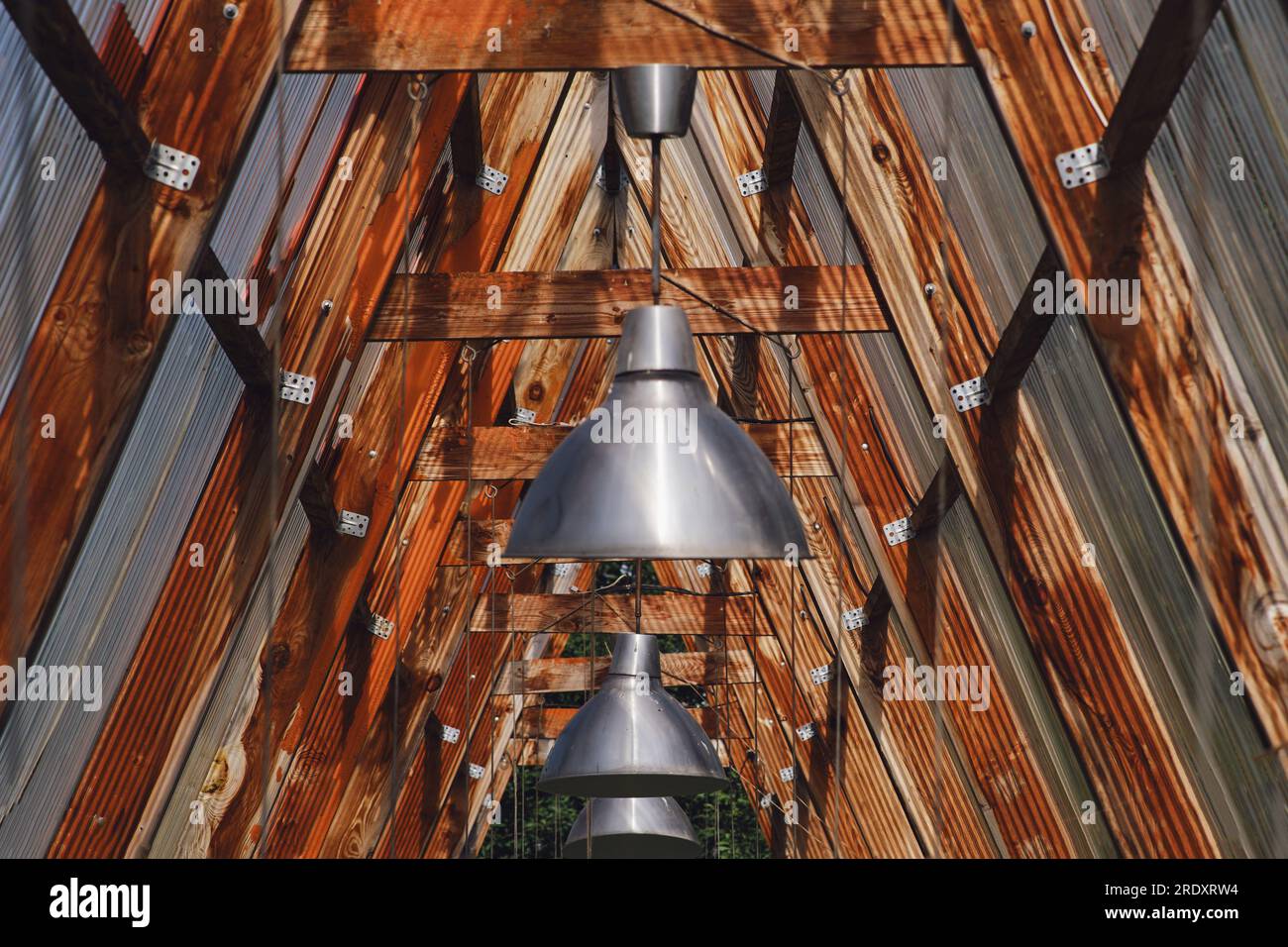 Lighting lamps for a large outdoor table in a metal casing Stock Photo ...