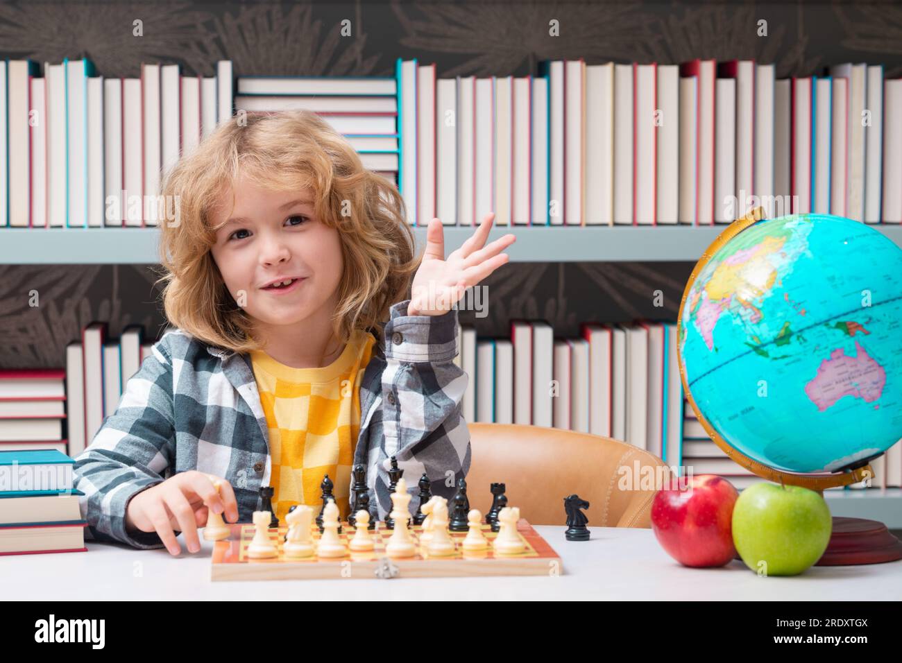 Chess school. Kid playing chess. Clever child thinking about chess ...