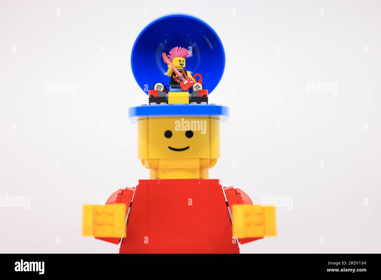 giant man have a mini boy inside his head as a punk rock singer Stock ...