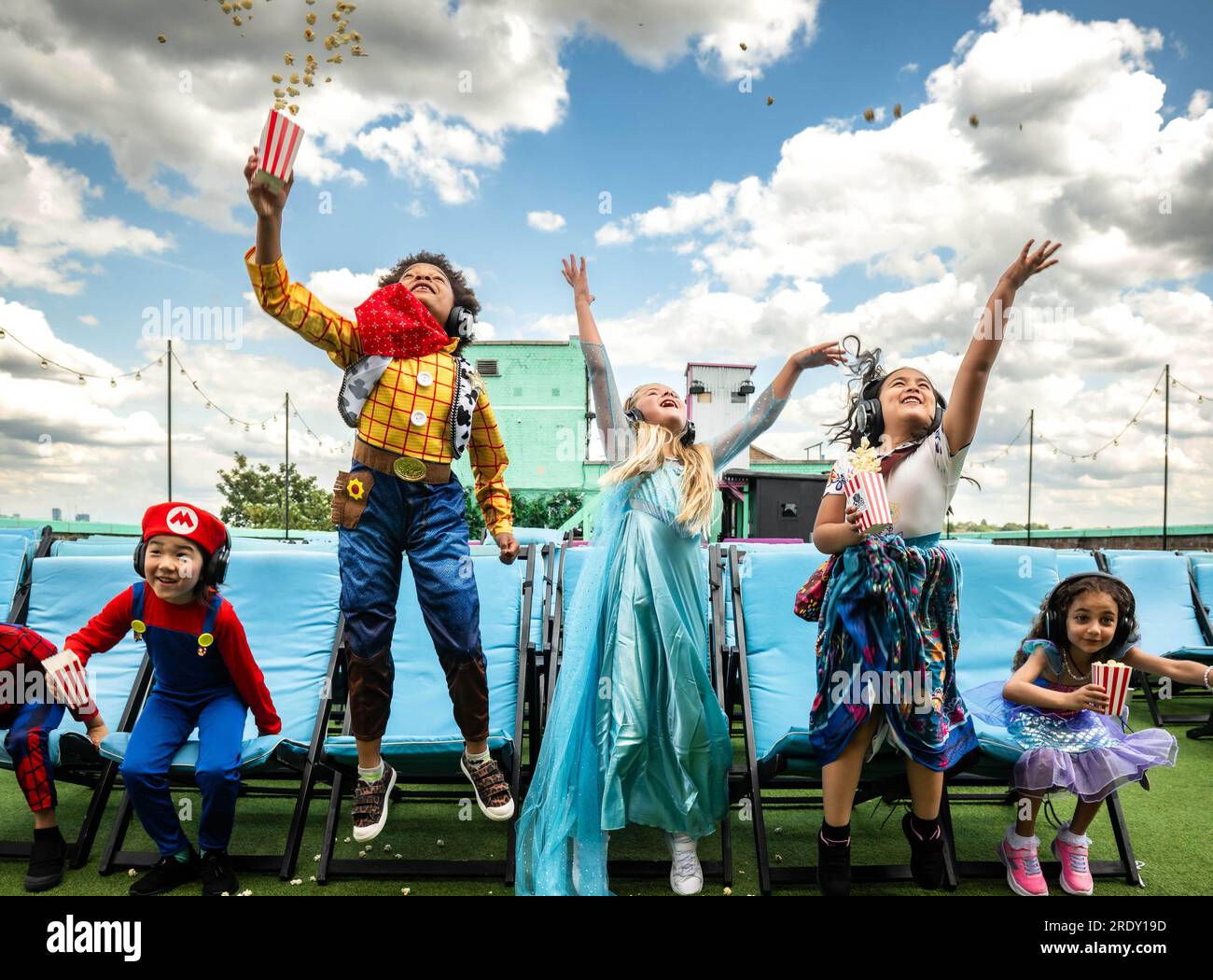 EDITORIAL USE ONLY Children take their seats at a summer daytime ...