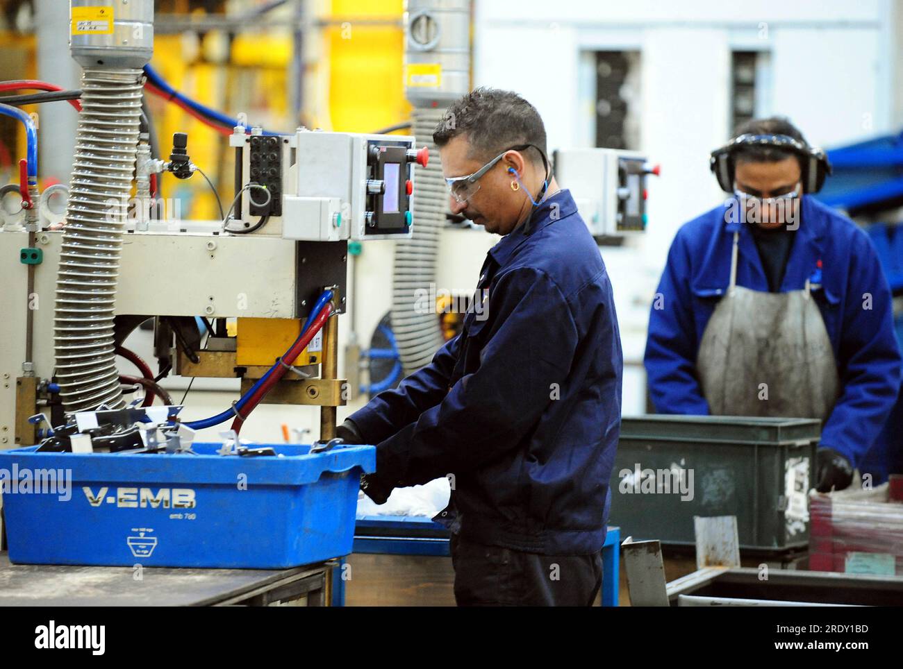File photo dated 06/01/14 of workers at a manufacturing company. Most ...