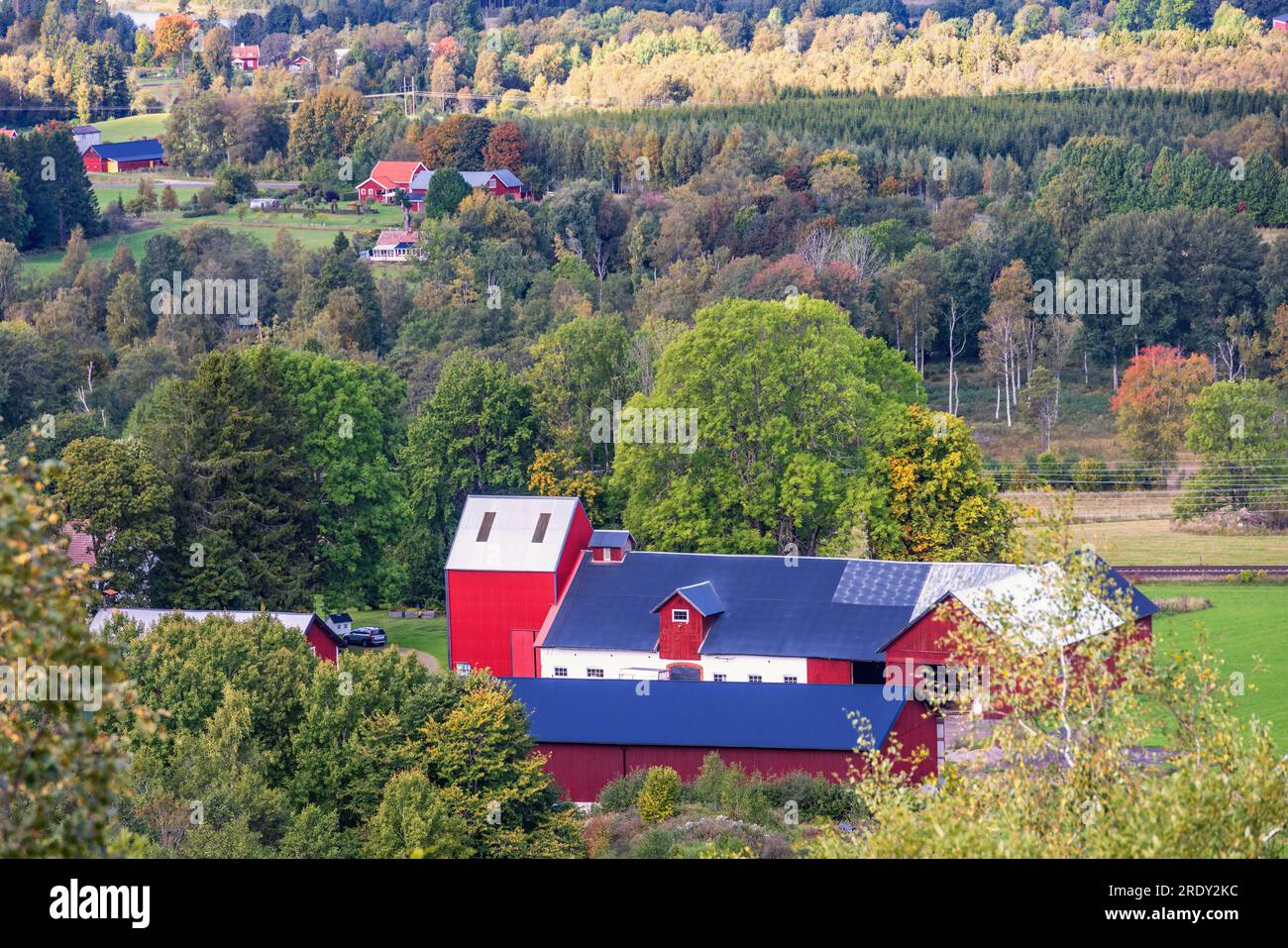 View at the countryside at autumn with a red barn Stock Photo - Alamy