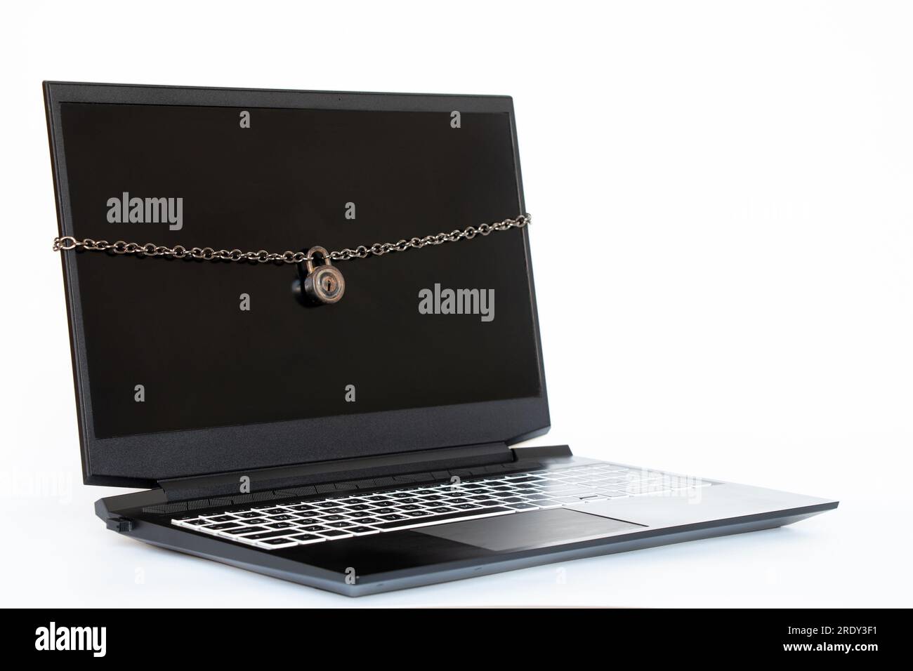 Black laptop tied with chain with a padlock on a white background ...