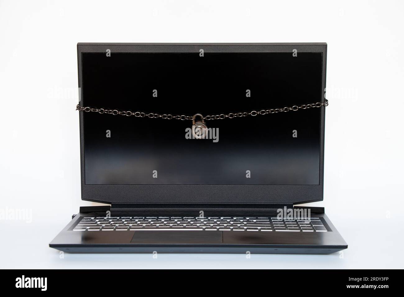Black laptop tied with chain with a padlock on a white background ...