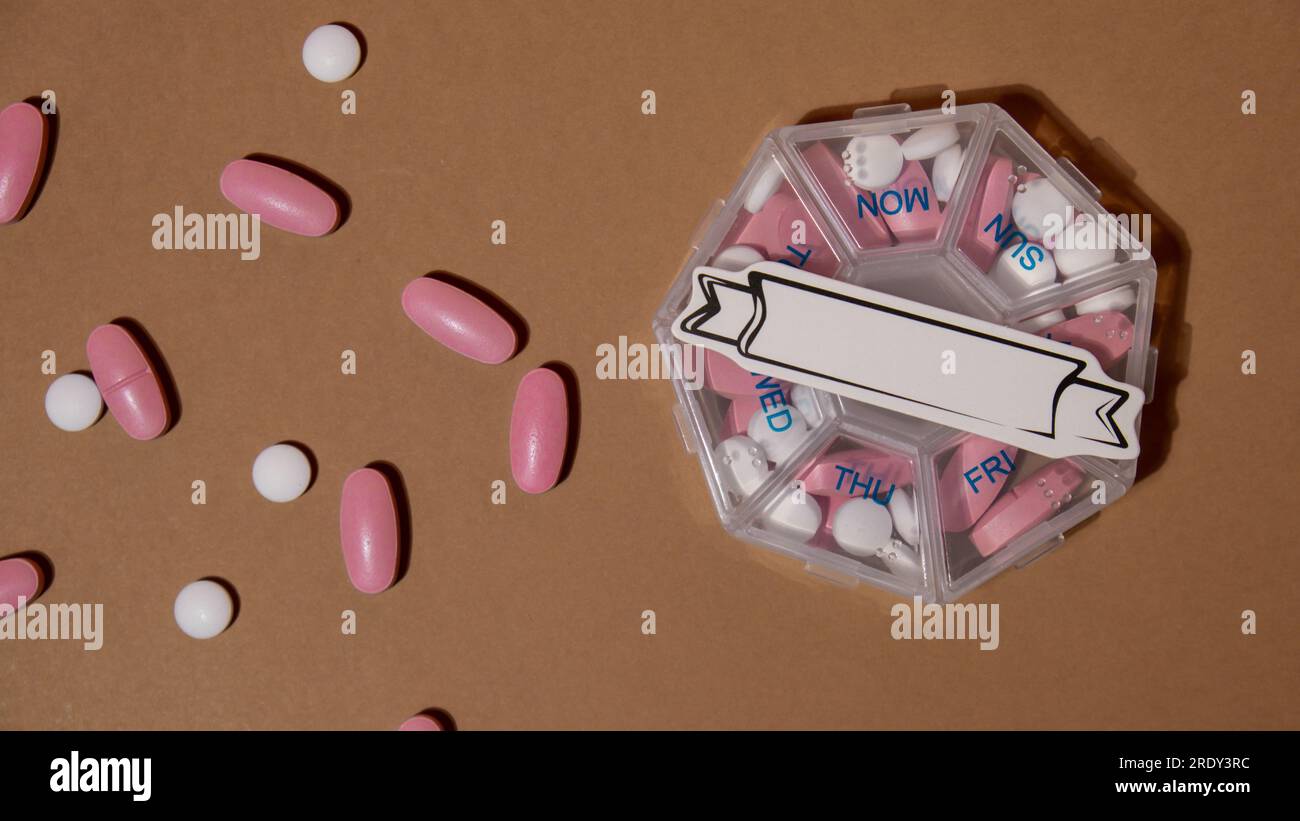 Closeup of medical pill box with doses of tablets for daily take ...