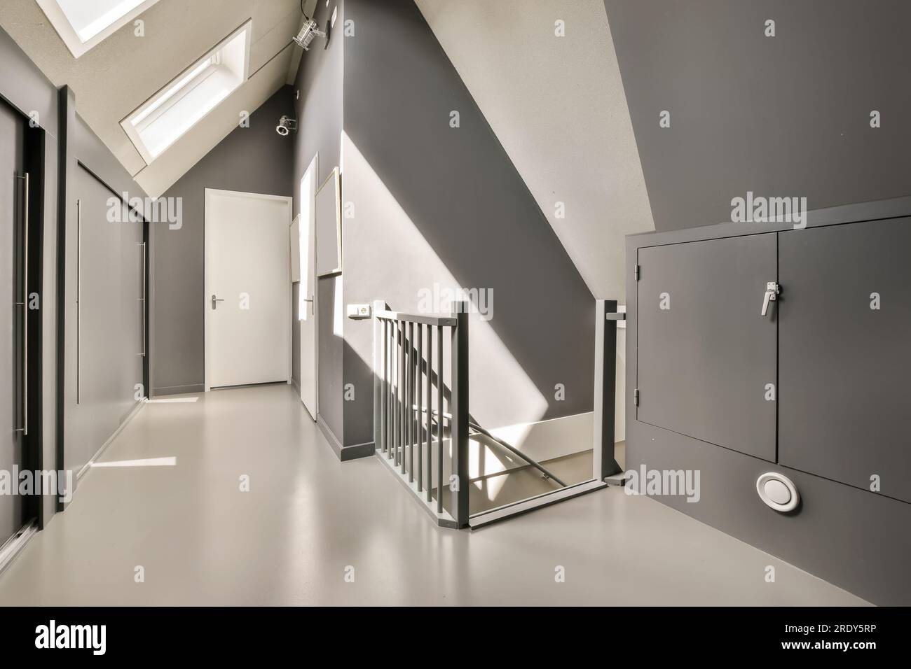 a hallway in an office building with stairs leading up to the second ...