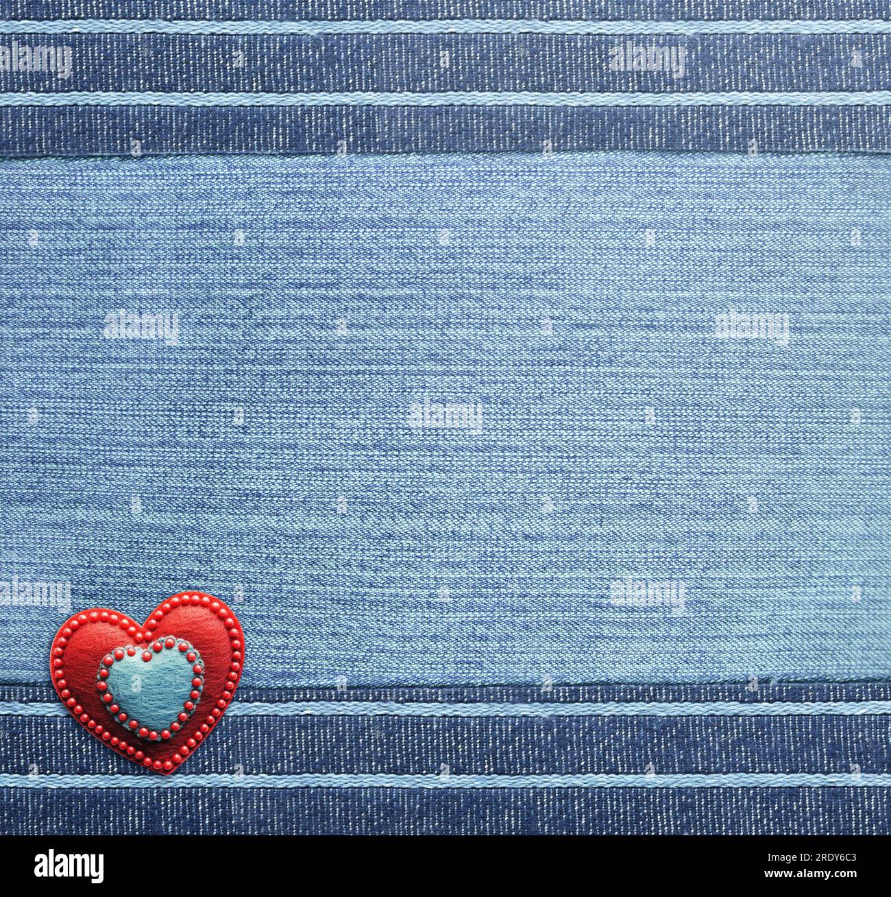 Blue denim background with striped borders and red felt heart. Navy ...