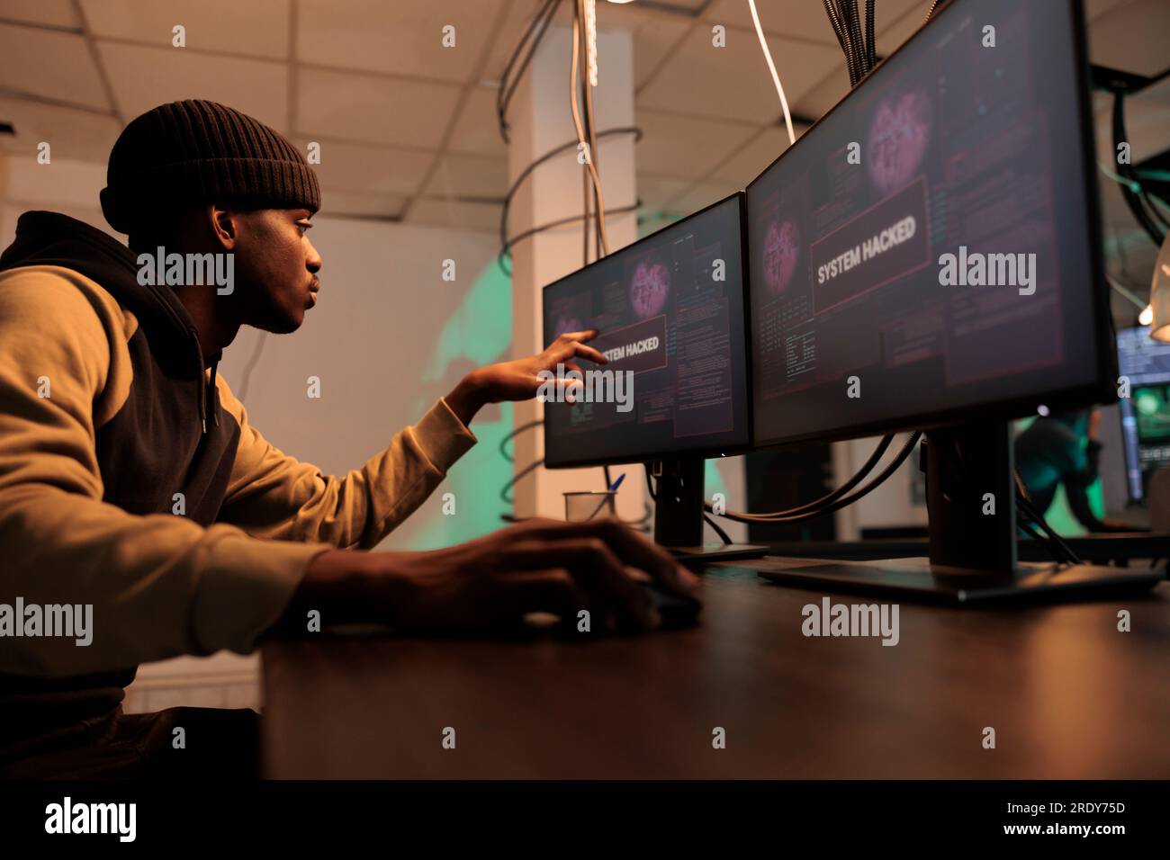 Back view criminal hacker working hi-res stock photography and images ...