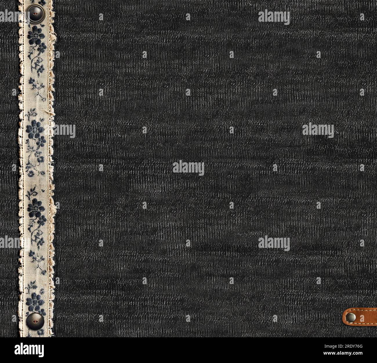 Black denim background with lace borders and small leather label. Dark ...