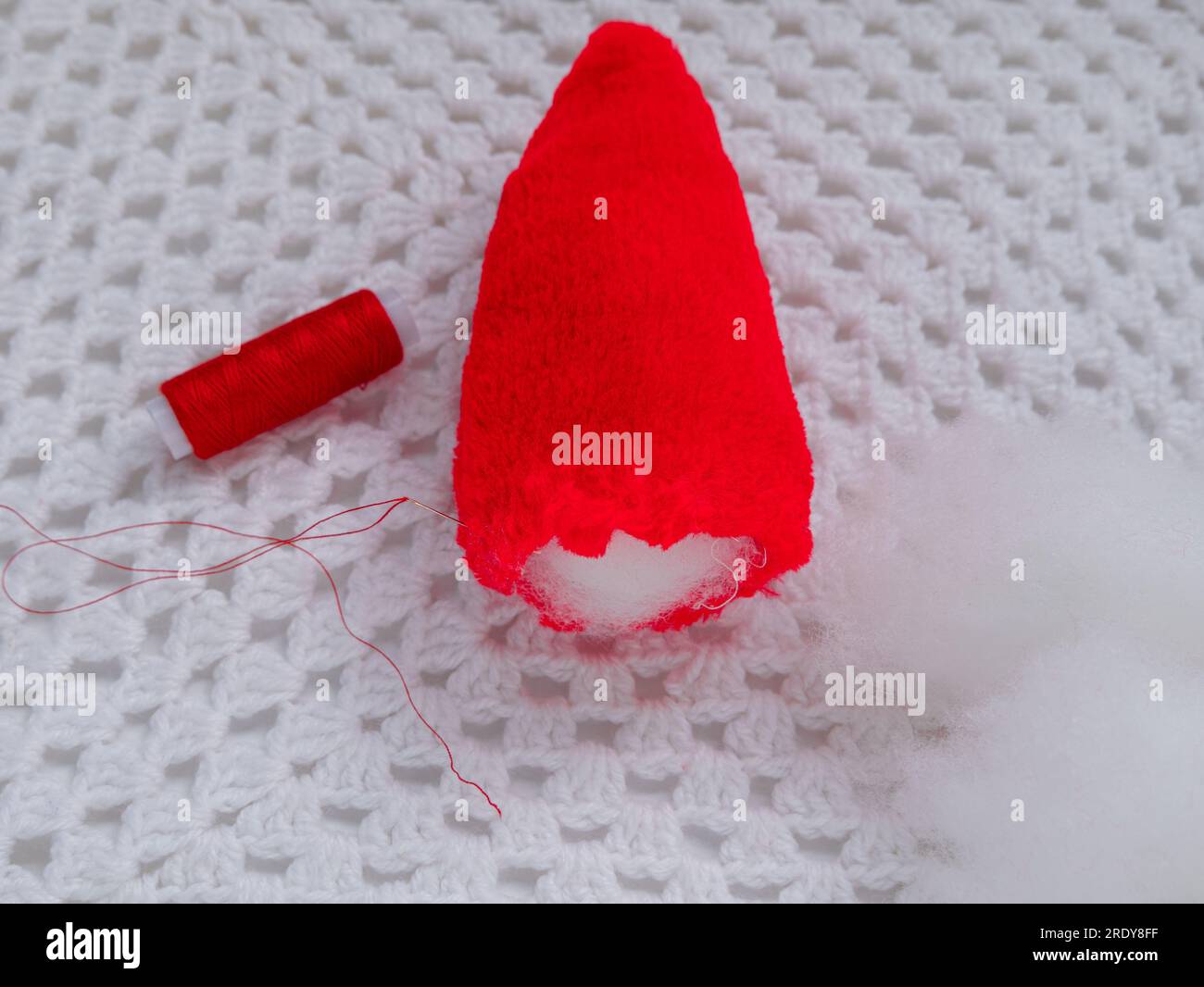 Scandinavian gnome with long beard red hat white knit background step ...