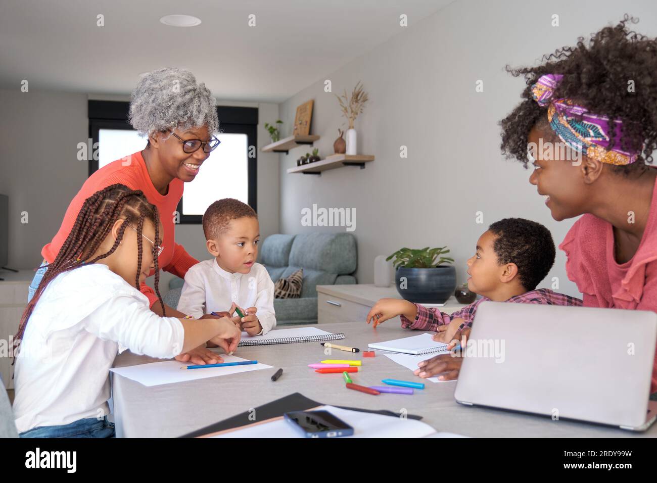African mothers helping children do their homework Stock Photo - Alamy