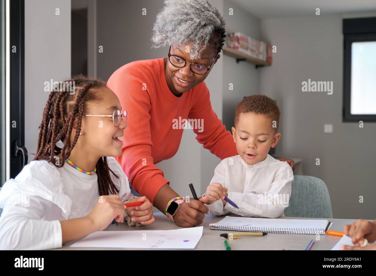 Helping daughter homework african hi-res stock photography and images ...