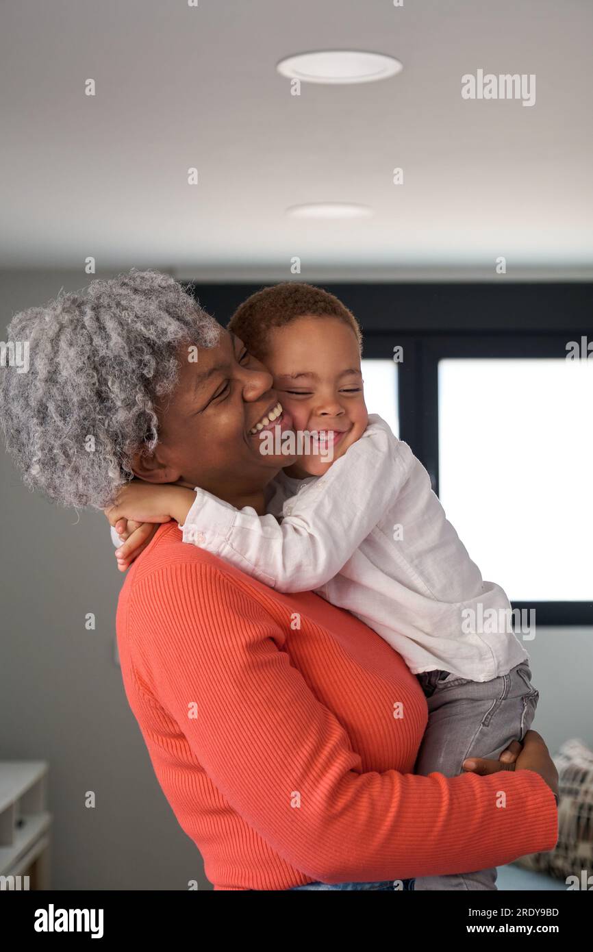 Happy african mother and toddler son hugging Stock Photo - Alamy