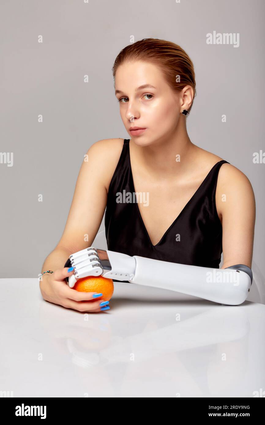 Young charming girl with disability wearing sensory bionic prosthetic ...
